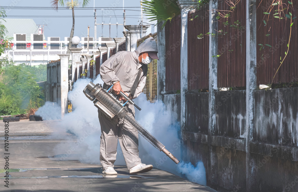 Healthcare worker using Fogging Machine Spraying chemical to eliminate ...