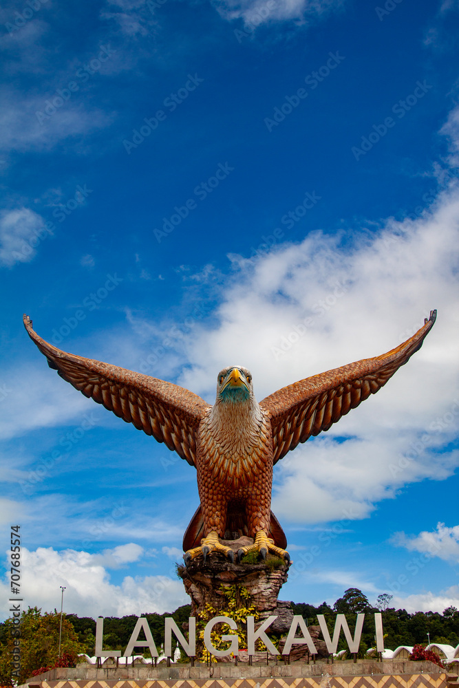 large bird statue next to the building with a sky background Stock ...