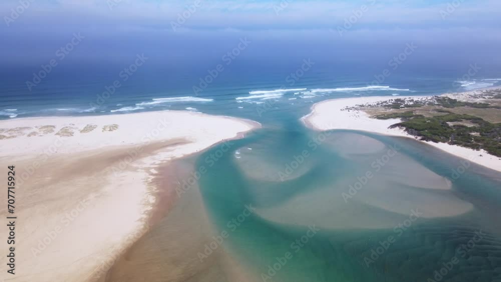 Lagoon estuary open to the ocean at the river mouth with beautiful sand ...