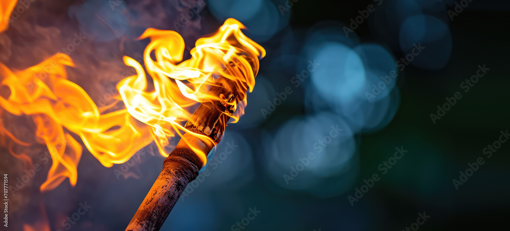 Ignited Torch with Blazing Flames with copy space. Close-up of a torch ...