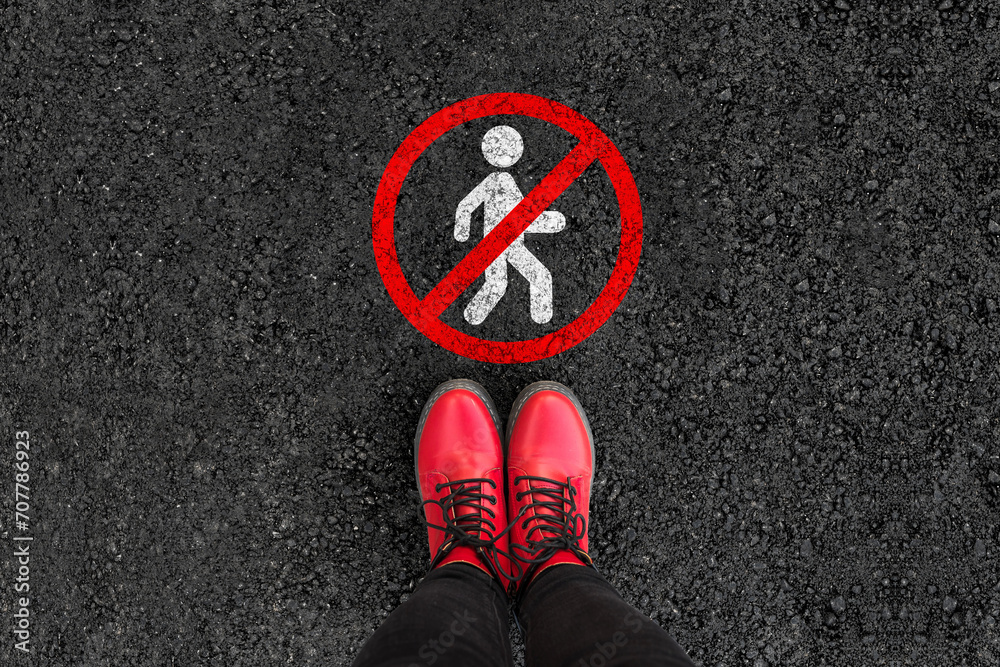 woman legs in boots standing on asphalt road and No walking sign Stock ...