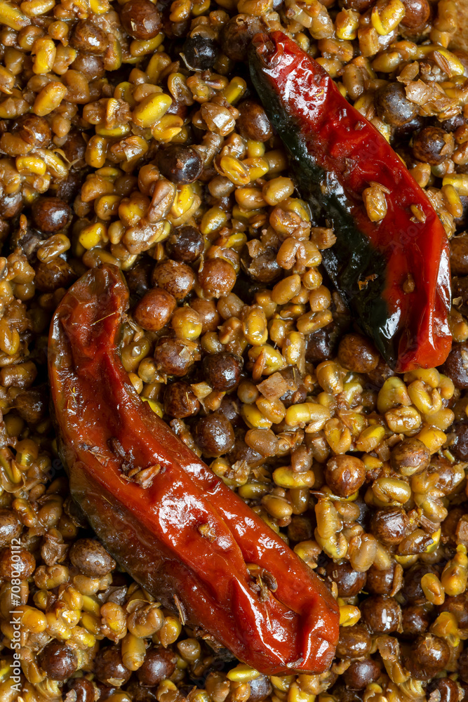 Close-up view of Methi Kerau with two roasted chili on top. Fenugreek ...