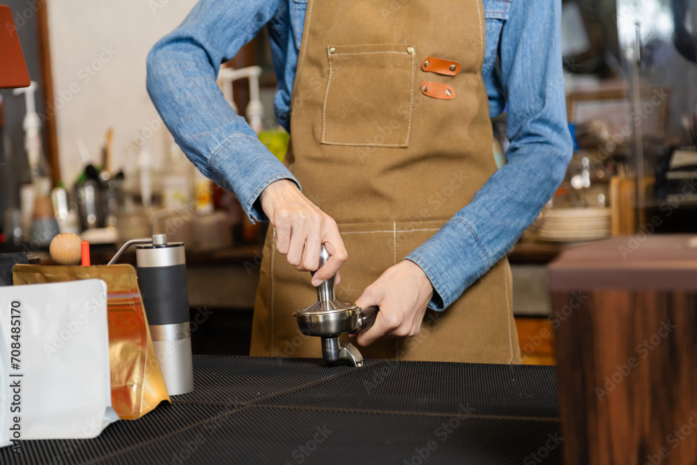 Asian barista female making hot coffee from professional machine ...
