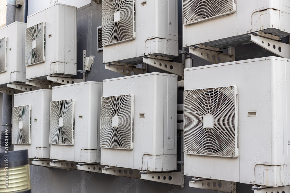 Air conditioner compressor installed in old building. Outdoor split ...