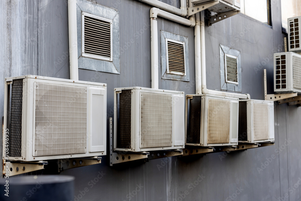 Air conditioner compressor installed in old building. Outdoor split ...