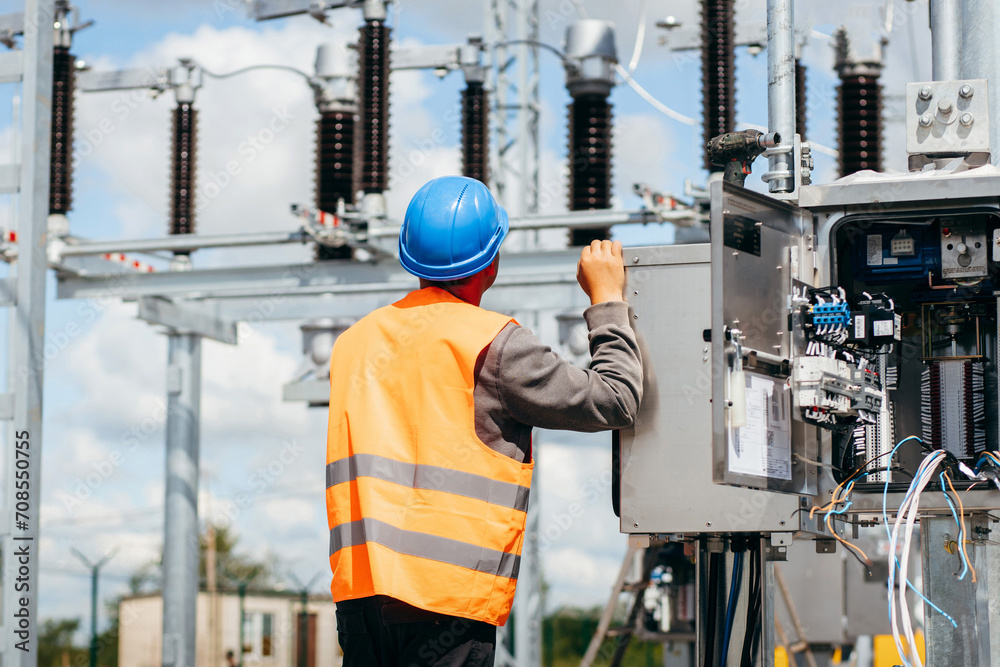 Adult electrical engineer inspect the electrical systems at the ...