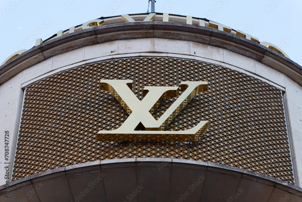 Louis Vuitton sign on facade of shop located at Champs Elysees avenue ...