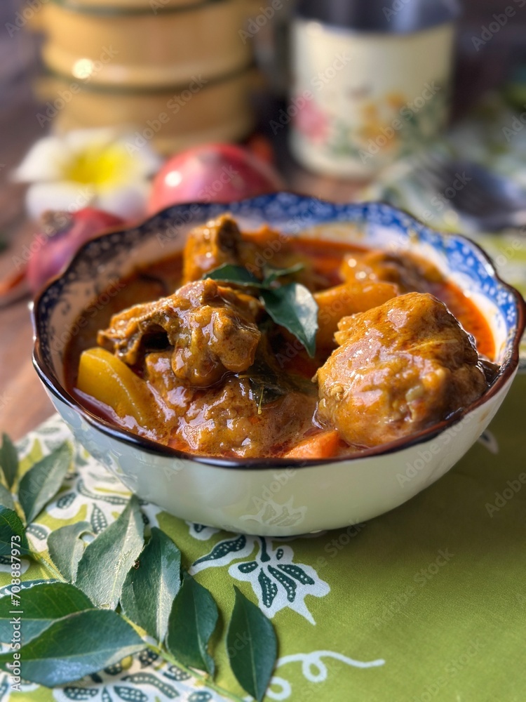 Malaysian style chicken curry with potatoes. kari ayam on traditional ...