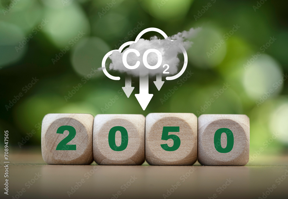 2050 with CO2 reducing icon on greenery background for decrease CO2 emission, carbon footprint ...