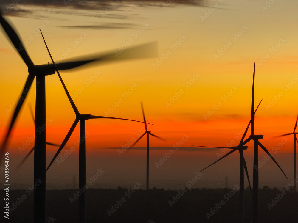 Wind farm landscape against sunset sky. Wind energy. Wind power ...