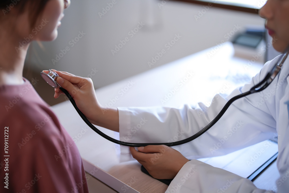 Asian psychologist women using stethoscope to check up patient and ...