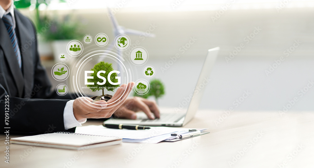 Businessman holding a green tree with esg icon. Concept of esg ...