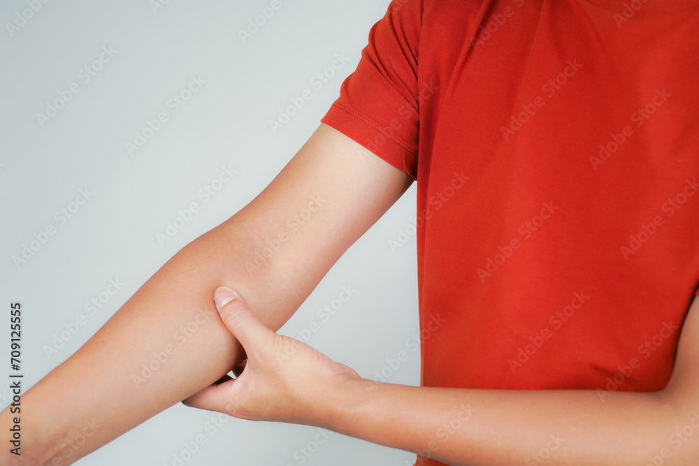 Health concept, person with elbow pain, man holding hand on elbow with ...