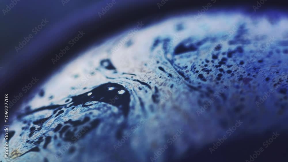 Foam texture ink flow. Defocused neon blue color oil paint emulsion ...