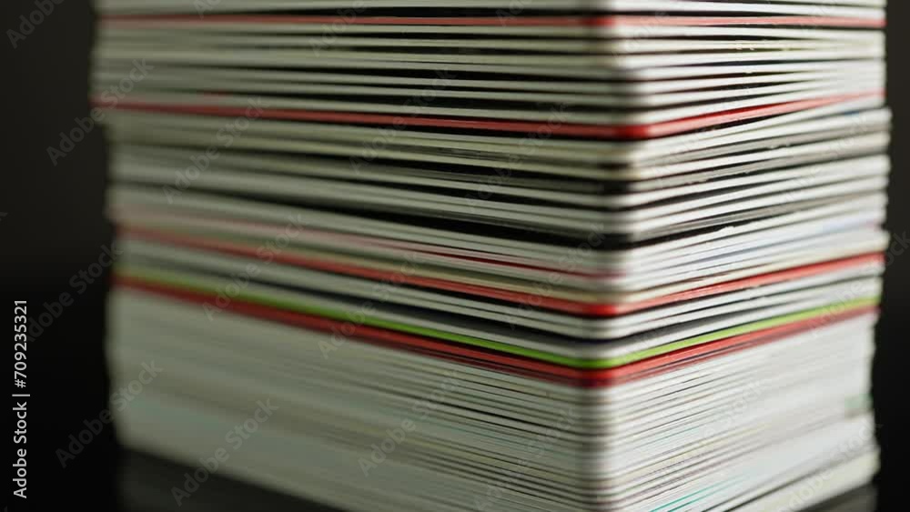 Credit and debit plastic cards pile on the table, slowly rotation ...