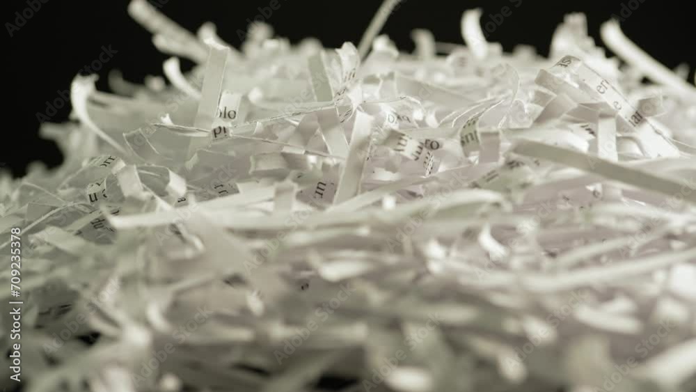 Shredded confidential documents on paper at the table. Office papers ...