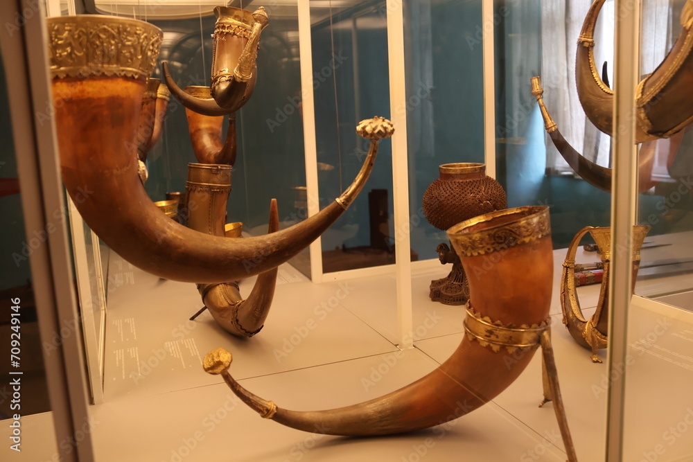 Medieval drinking horns display in the glass cabinet Stock Photo ...