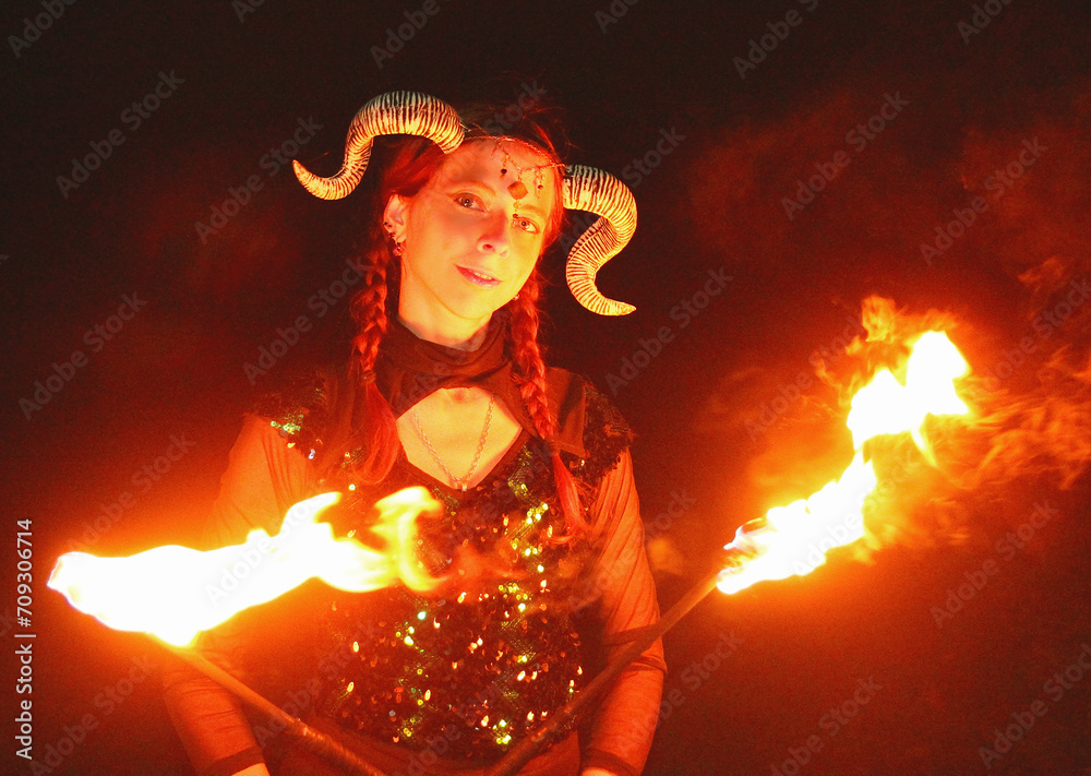 Selfie portraits of a red-haired woman in a shiny gothic outfit, with ...