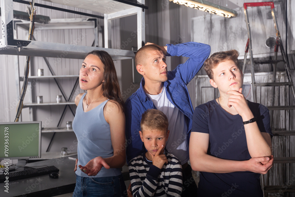 Friendly young family of four with two teen boys spending time together ...