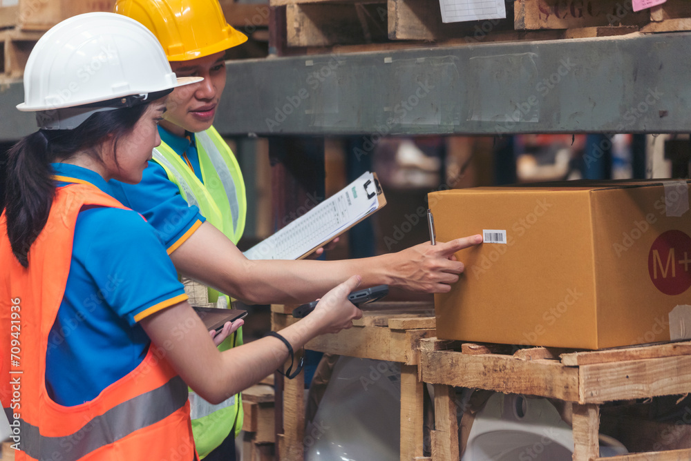 Warehouse management team check stock inventory. Asian men women worker ...