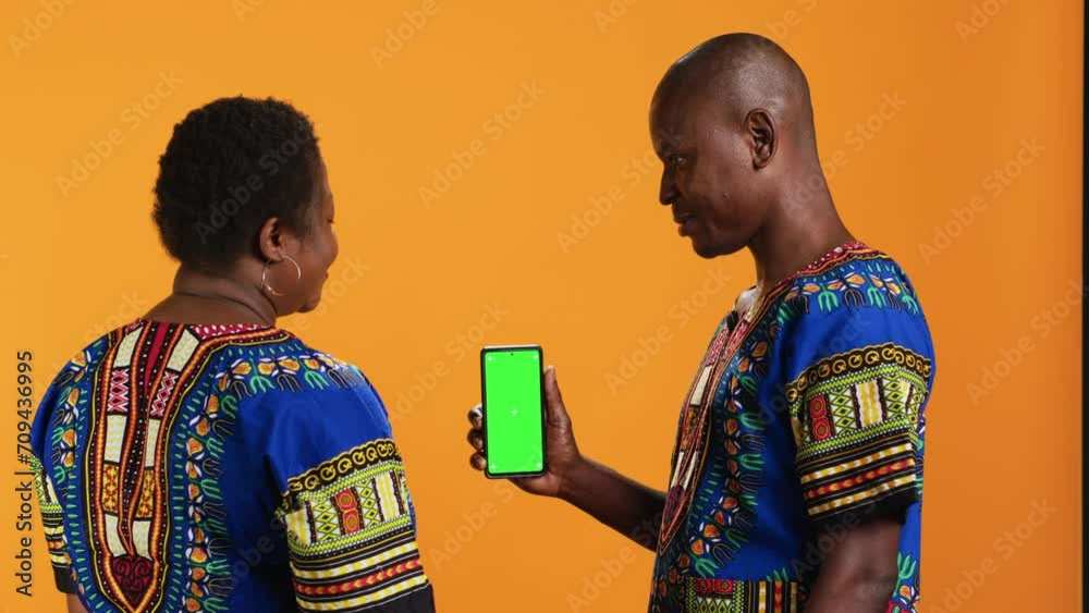 African american people showing greenscreen display in studio, man in ...