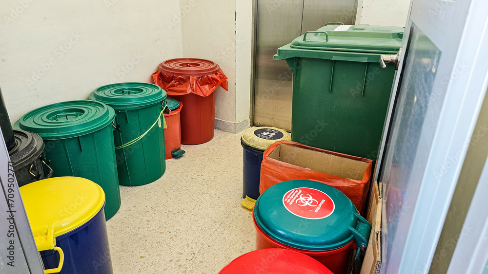 Medical waste disposal bins in hospital. Garbage assorting trashcans in ...
