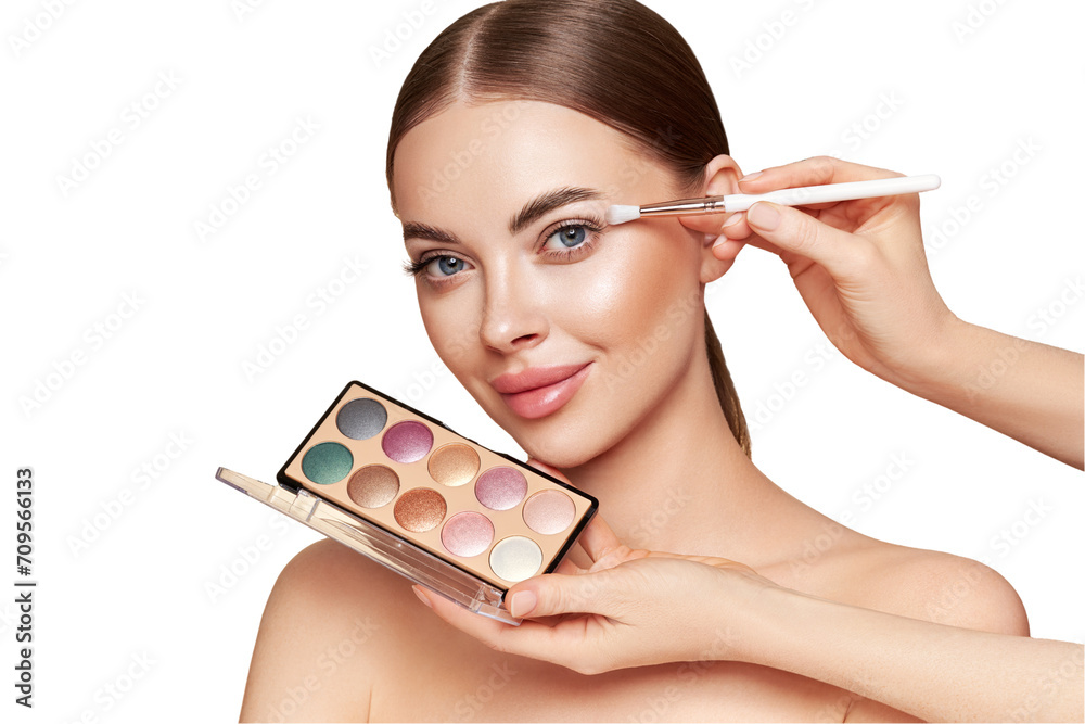 Makeup Artist applies Eye Shadow. Beautiful Woman Face. Perfect Makeup ...