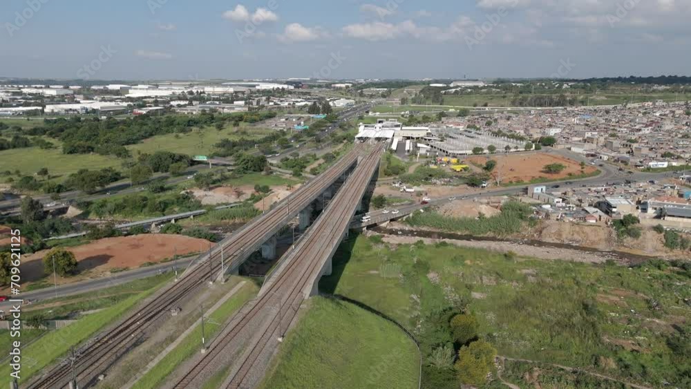 Rotating drone captures a scenic view of a railway bridge close to an ...
