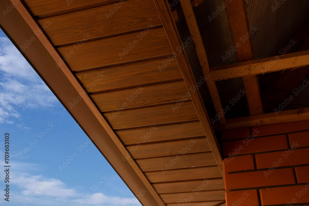 Roof overhang with metal siding Stock Photo | Adobe Stock