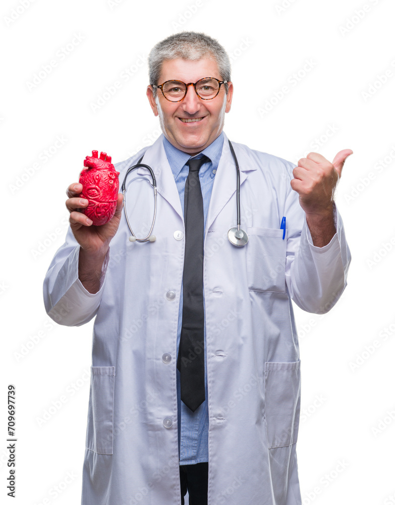Handsome senior cardiologist doctor man holding heart over isolated ...