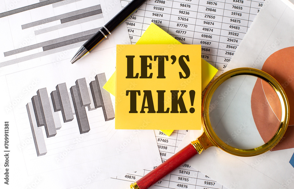 LET S TALK text on a sticky on the graph background with pen and ...