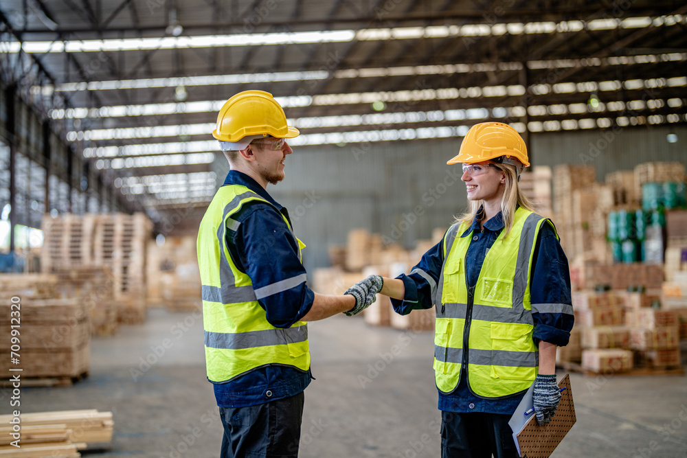 workers man and woman engineering walking and handshakeing with working ...