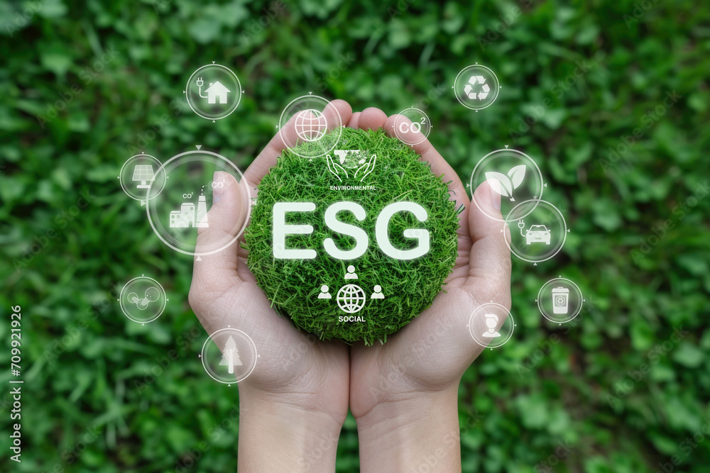 Hand holding global ESG icon of saving clean energy environmental ...