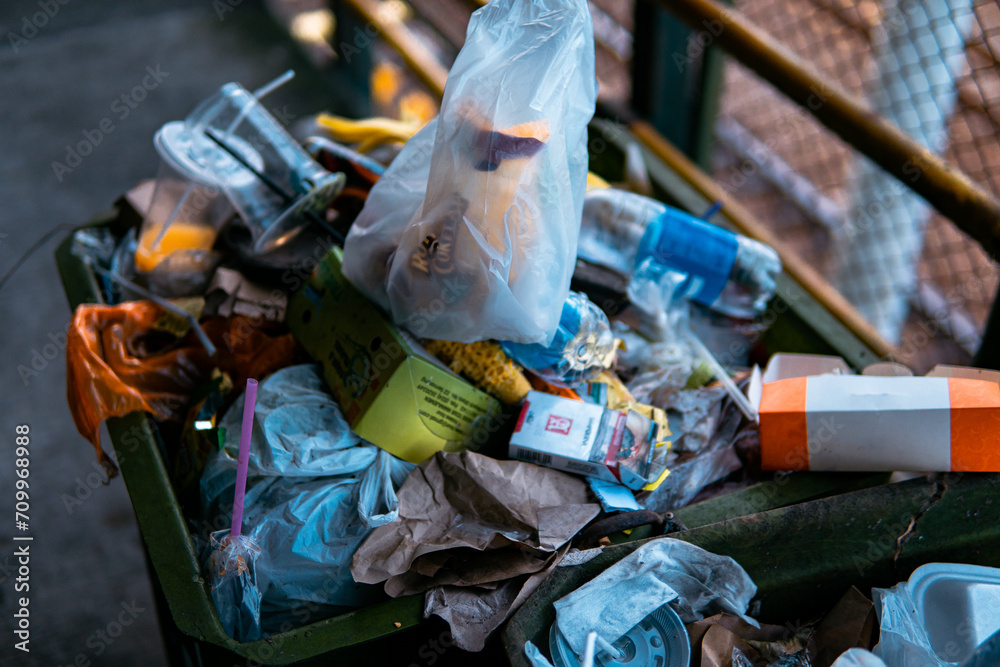 Trash cans in public places contain rotten food and plastic packaging ...