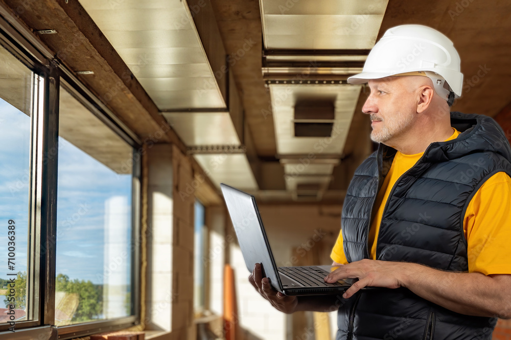 Man engineer. Engineering Communication. Engineer stands under ...