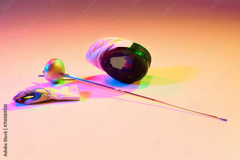 fence athlete equipment. Mask and fencing sword on light background in ...