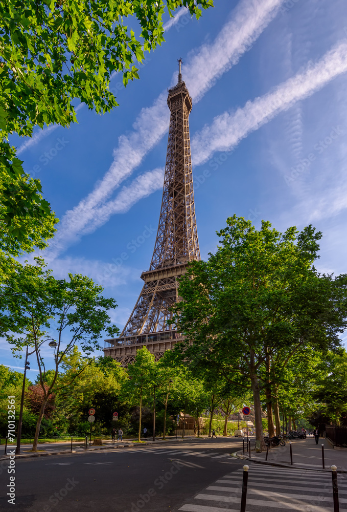 Street with Paris Eiffel Tower in Paris, France. Eiffel Tower is one of ...