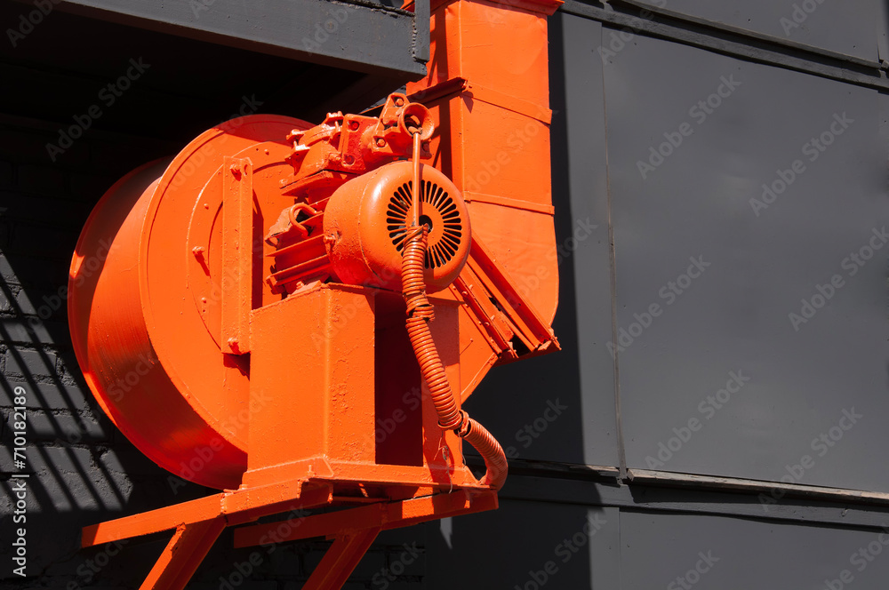 External industrial orange engine with a turbine for extracting exhaust ...