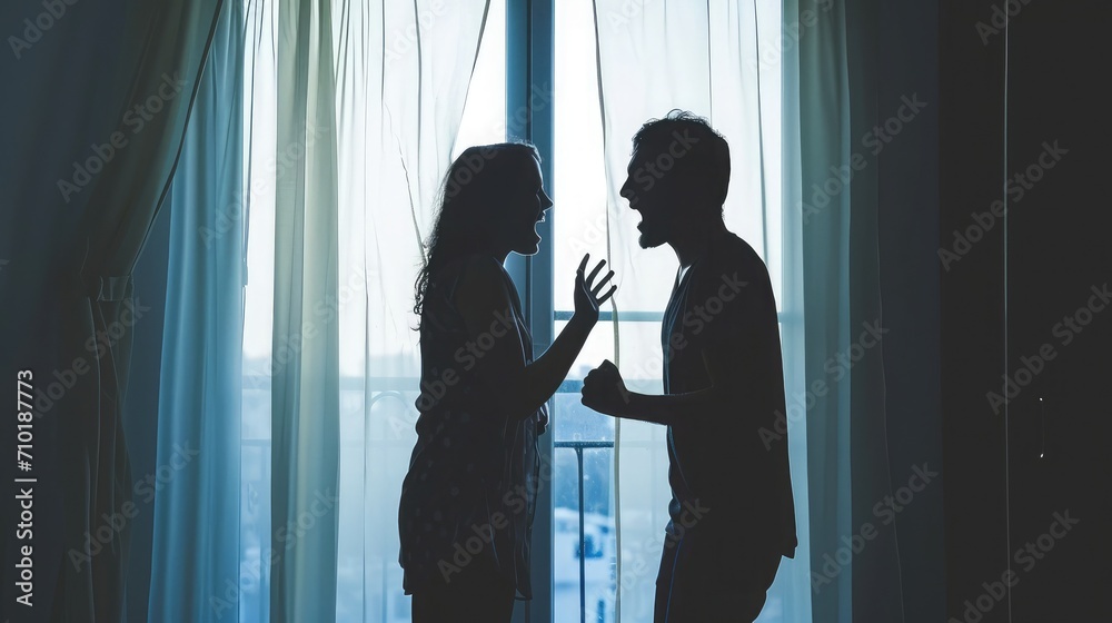 Silhouette of couple fighting each other, arguing and yelling at one ...