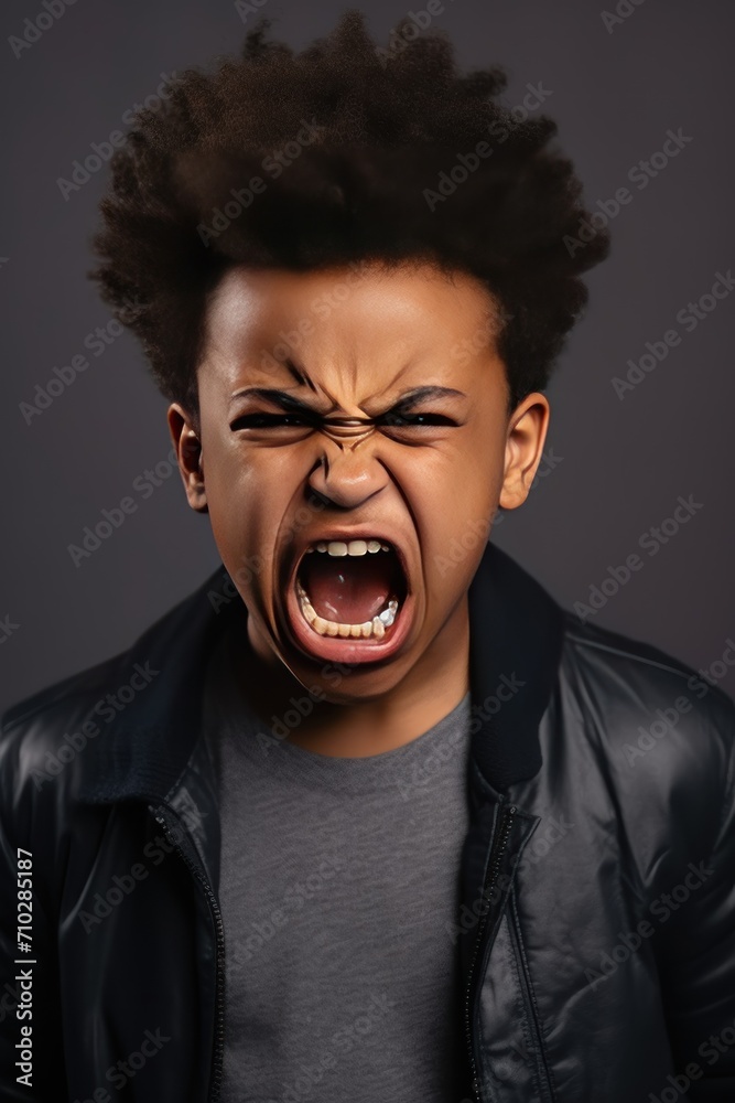 Angry irritated African American boy. Close-up portrait. Full of rage ...