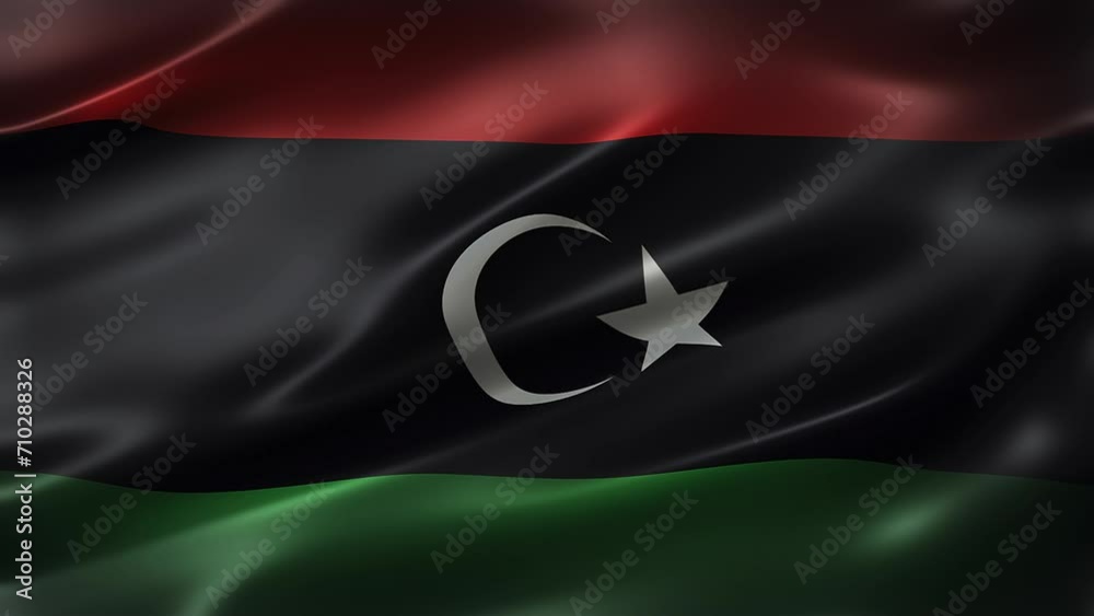 The Flag of Libya full frame, front view, flapping in the wind, with a ...