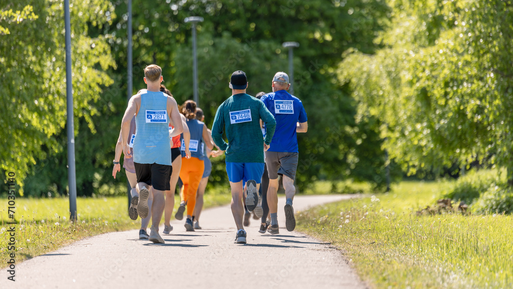 Wide Shot Back View of Diverse Marathon Participants Competing in a ...