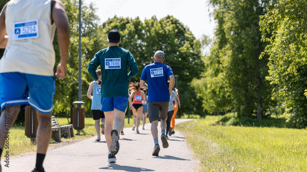 Back View of Diverse Marathon Participants Competing in a Race for the ...