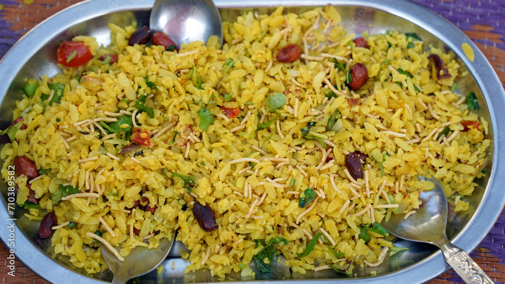 indian breakfast dish poha.Indian breakfast Poha topped with peanuts ...