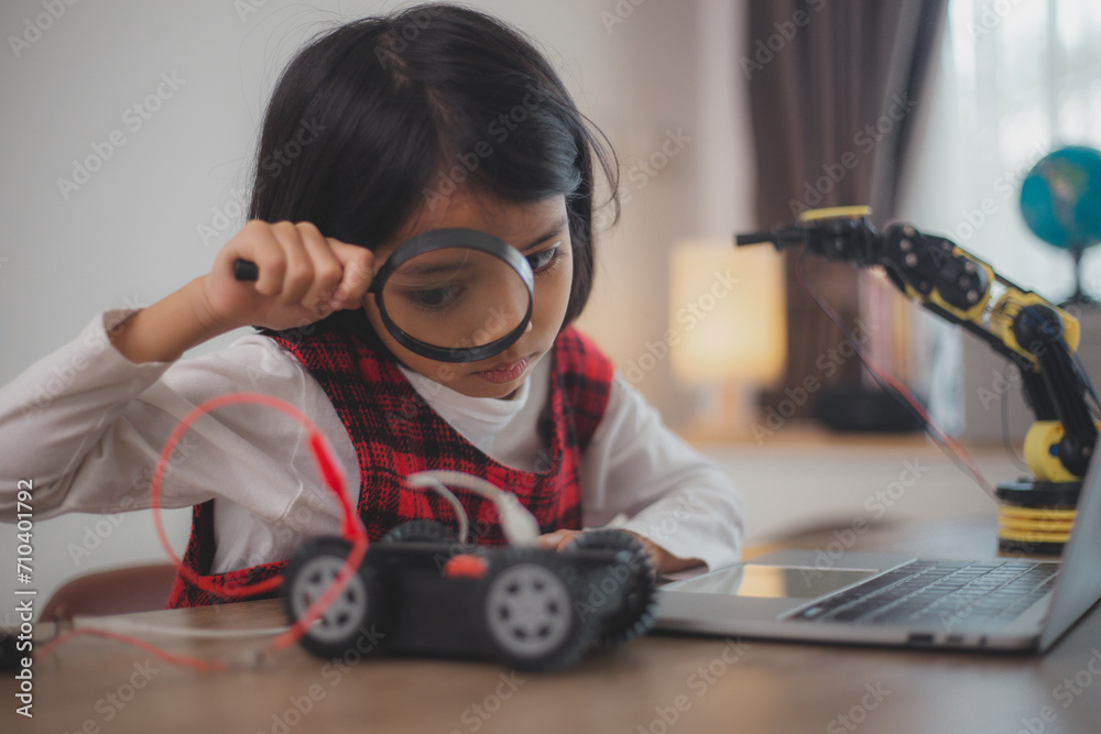 STEM education concept. Asian students learn at home by coding robot ...