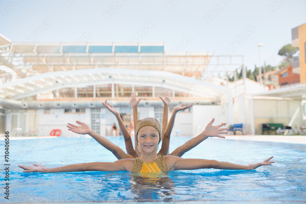 Group of eight teenage synchronized swimmers in a swimming pool ... Group of eight teenage synchronized swimmers in a swimming pool ...