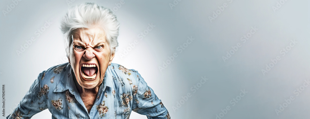 Elderly woman grandmother screams in angry anger, aggressively ...