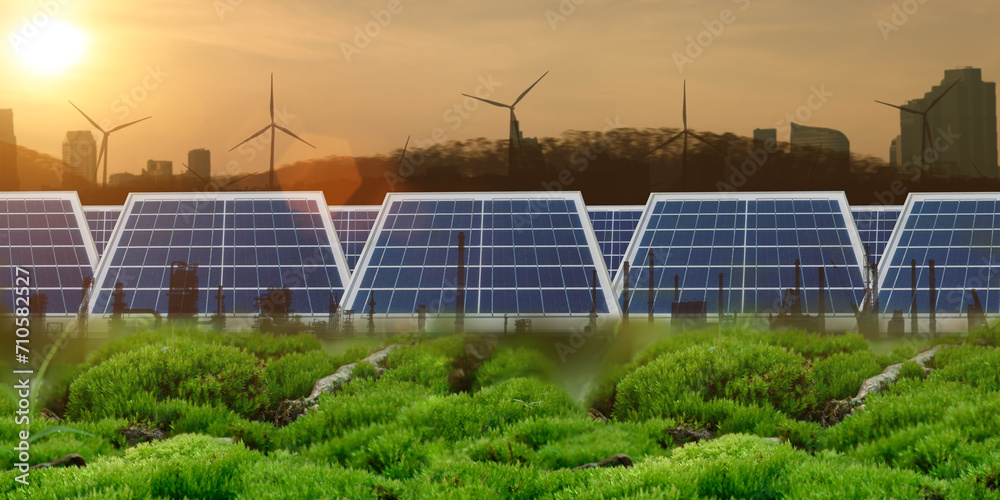 Double exposure graphic renewable energy concept. Solar panels with wind turbines and an ...