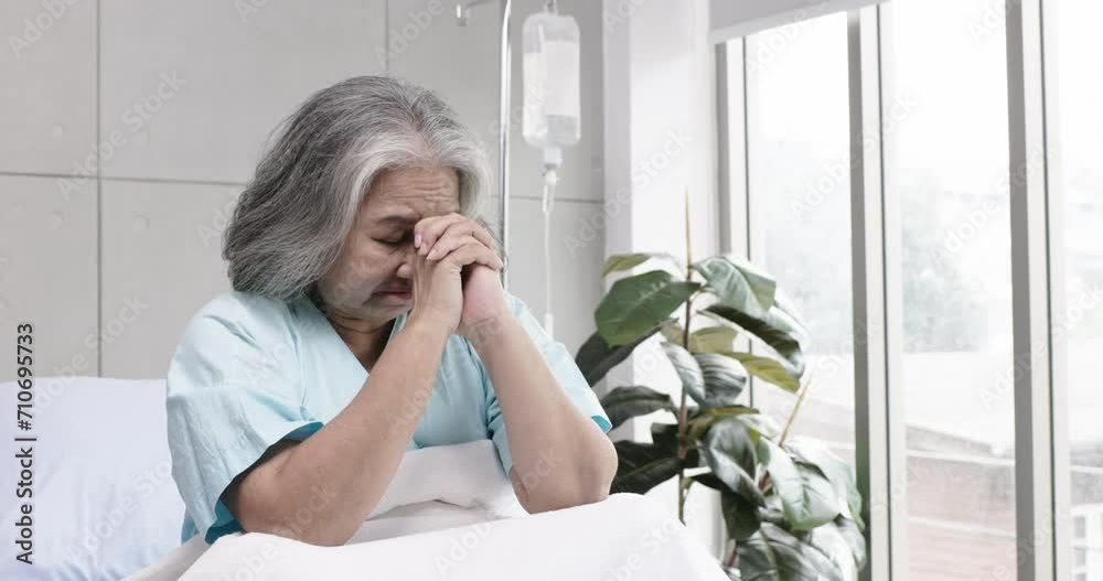 Sick Asian elderly woman lying in hospital suffering from stress and ...