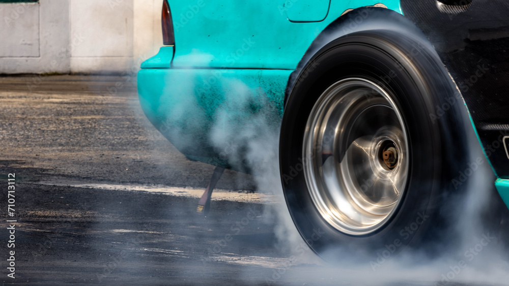 Foto de Car burnout wheels tire with white smoke,Car wheel burnout with ...